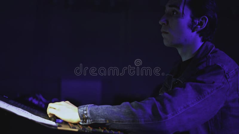 Technician Works at Stage Console. Media. Young Man is Working at ...