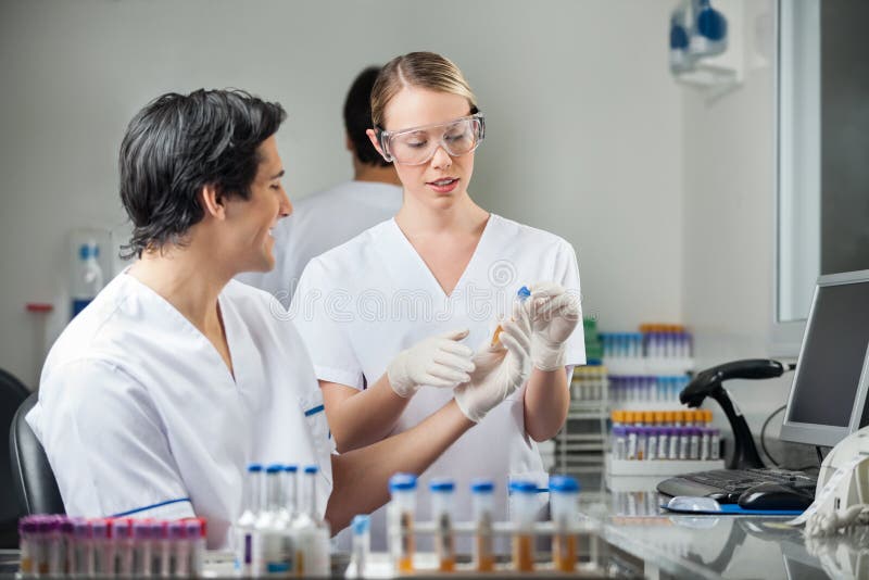Technicians Analyzing Sample in Medical Lab Stock Photo - Image of male ...
