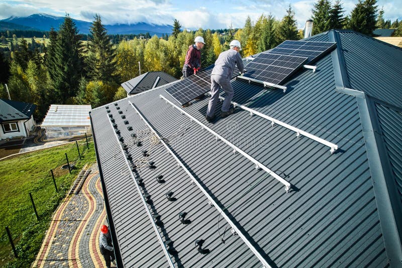 Technicians Carrying Photovoltaic Solar Module while Installing Solar ...