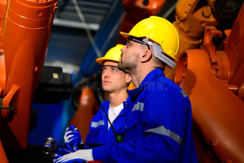 Technicians Engineers Team Checking and Maintaining Safety of Machine ...