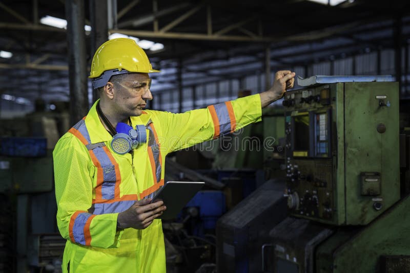 Technicians and Engineers are Working on Machines in a Factory ...