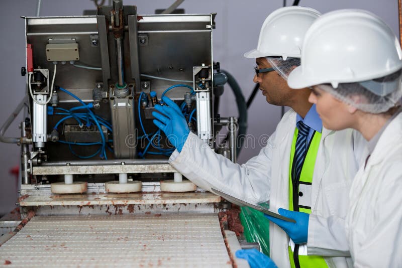 Technicians Examining Meat Processing Machine Stock Image - Image of ...