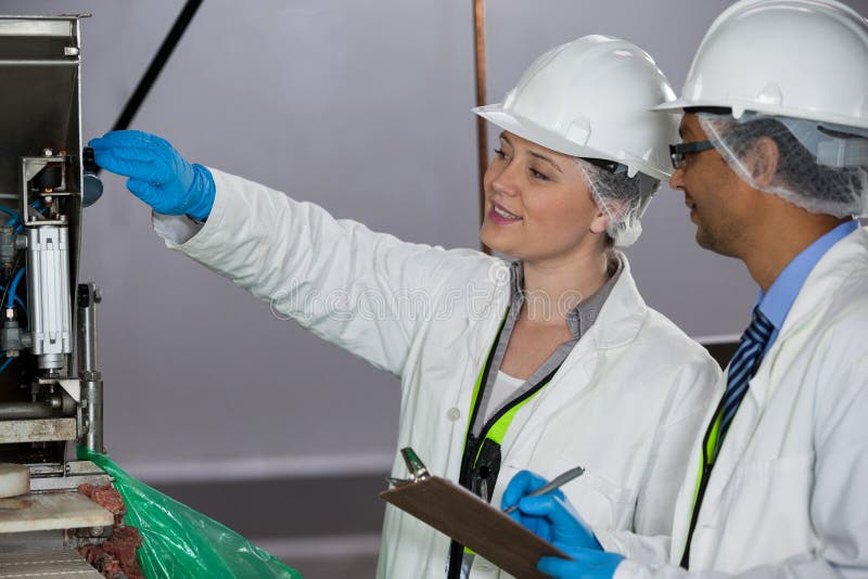 Technicians Examining Meat Processing Machine Stock Image - Image of ...