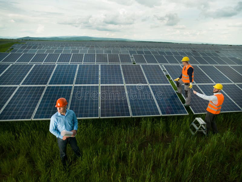 Technicians Inspecting Solar Panel Station Stock Photo - Image of ...