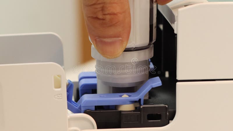 Technicians are Installing Setup the Ink and Insert Ink into the Fill ...