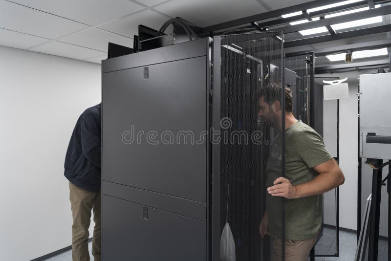 Technicians Team Updating Hardware Inspecting System Performance in ...