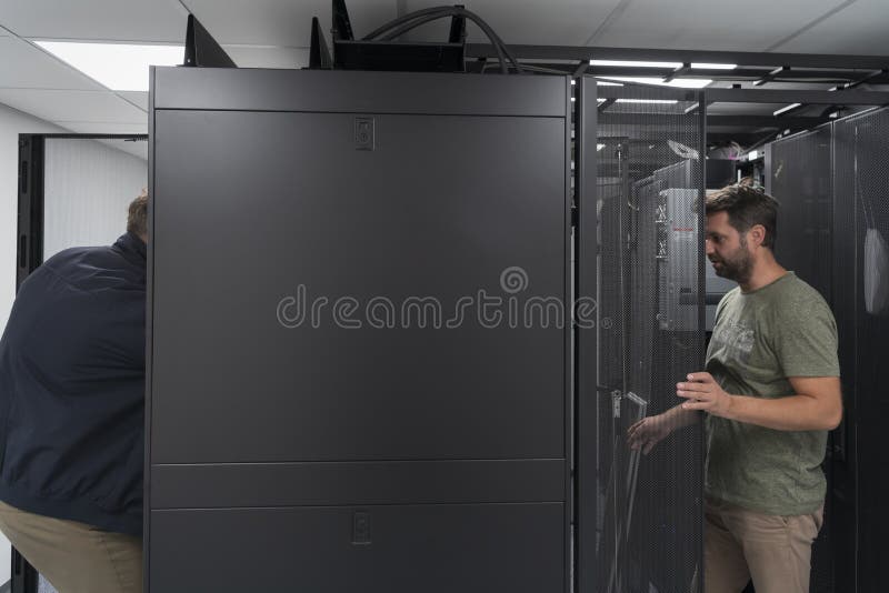 Technicians Team Updating Hardware Inspecting System Performance in ...