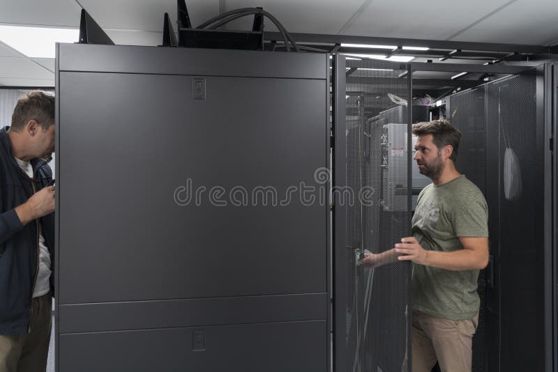 Technicians Team Updating Hardware Inspecting System Performance in ...