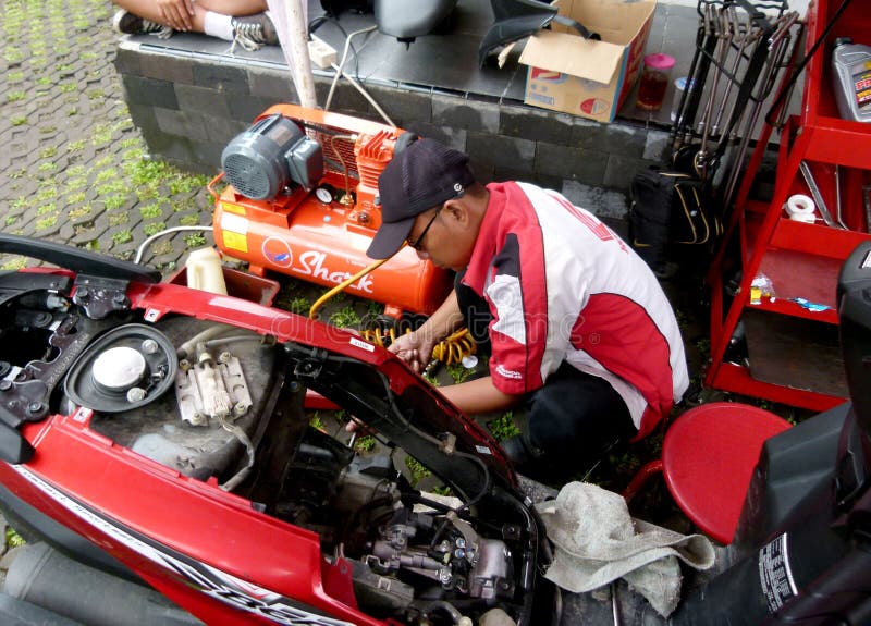 Mechanic Repairing Motorcycle At Garage Editorial Photo - Image of ...