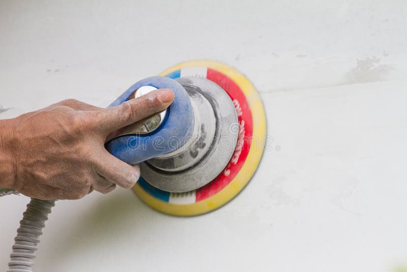 Technicians are Using a Hand Polish Machine To Scrub To Smooth Plaster ...
