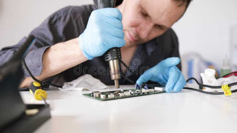 Technicians are Using a Soldering Iron for Repairing Electronic of the ...