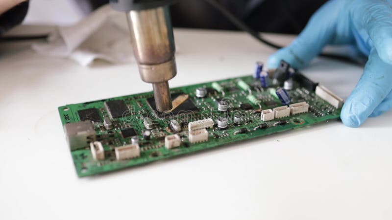 Technicians are Using a Soldering Iron for Repairing Electronic of the ...