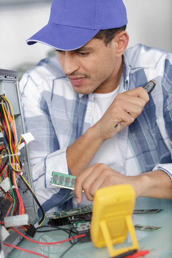 Technicians Working on Broken Computer in Workshop Stock Image - Image ...