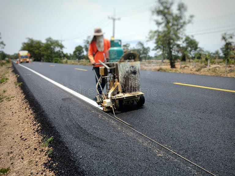 Technicians are Working on Traffic Lines on the Asphalt Surface Stock ...
