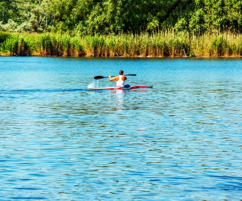 Technique of Rowing of a Single Athlete on a Kayak. Paddle Splash ...