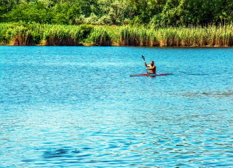 Technique of Rowing of a Single Athlete on a Kayak. Paddle Splash ...