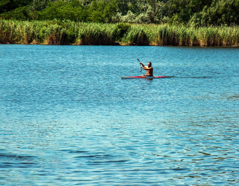Technique of Rowing of a Single Athlete on a Kayak. Paddle Splash ...