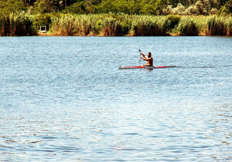 Technique of Rowing of a Single Athlete on a Kayak. Paddle Splash ...