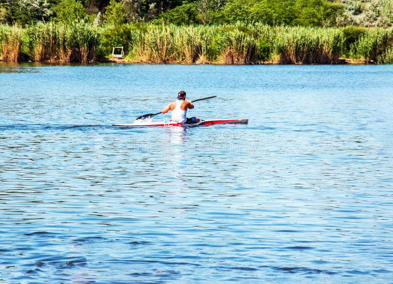 Technique of Rowing of a Single Athlete on a Kayak. Paddle Splash ...