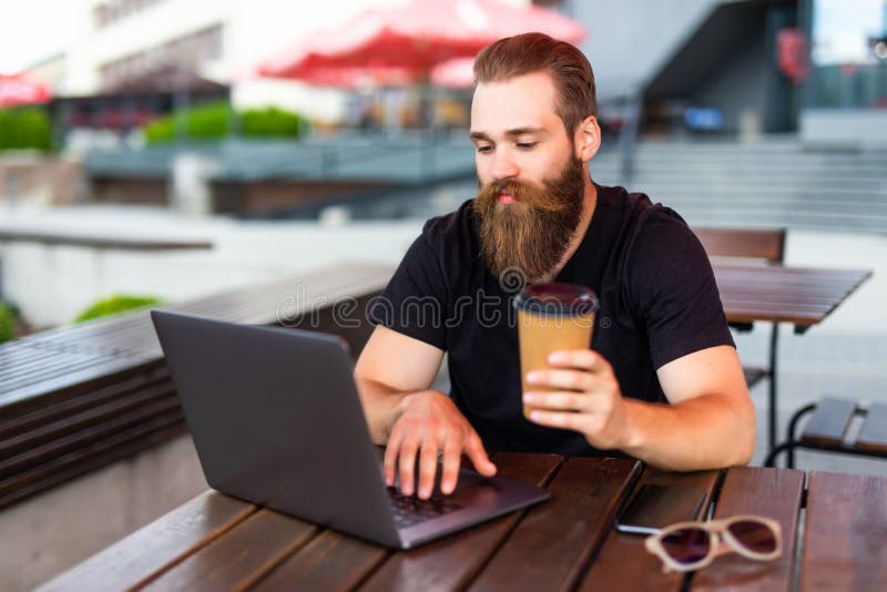 Technologies Making Life Easier. Serious Young Man Working on Laptop ...