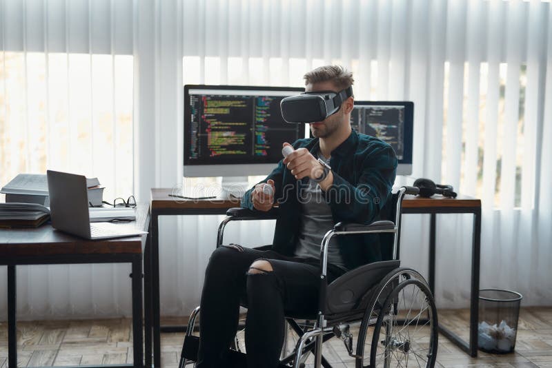 Technologies Which Change the World. Young Male Web Developer in a Wheelchair Wearing Virtual ...