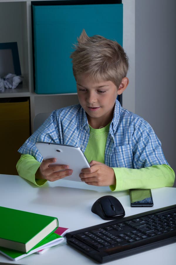 Technology in boy s life stock photo. Image of sitting - 44090590