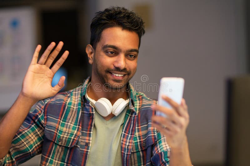 Man with Smartphone Having Video Call at Office Stock Photo - Image of ...