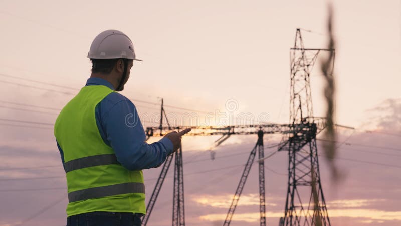 Technology Concept with High Voltage Power Lines. Electrical Engineer ...