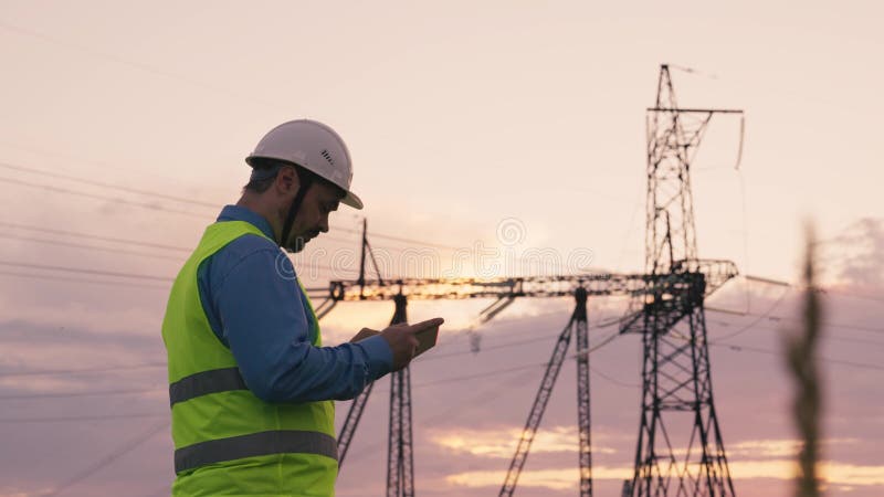 Technology Concept with High Voltage Power Lines. Electrical Engineer ...