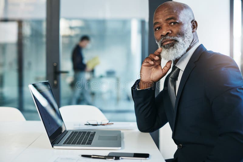 Technology Cuts My Workday in Half. a Mature Businessman Working in a ...