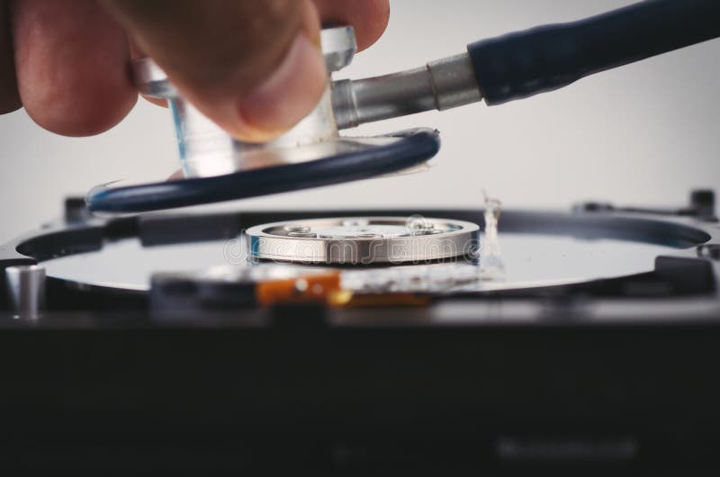 Hand Holding Stethoscope for Diagnose Old Dusty Disassembled Hard Drive ...