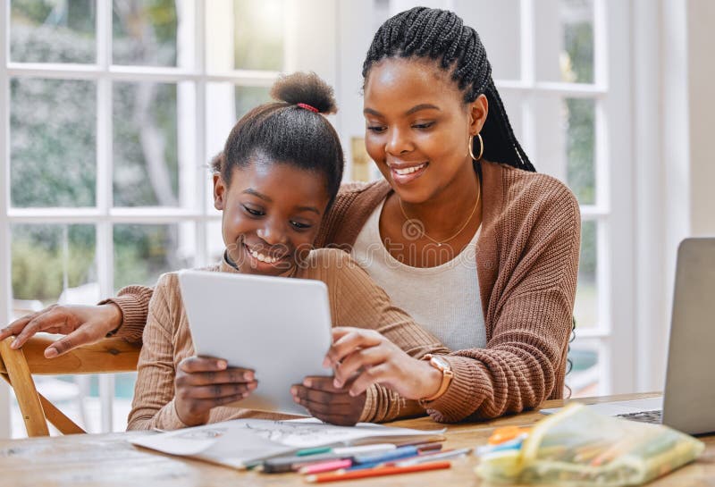 Technology Helps Make Homework Easier. a Young Mother and Daughter ...
