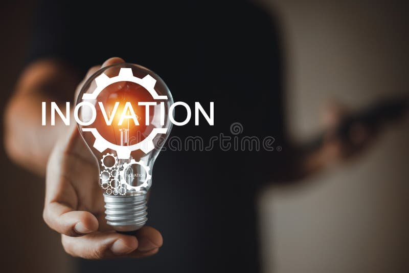 Technology Innovation Concept. Hand Holding Light Bulbs with Innovation ...