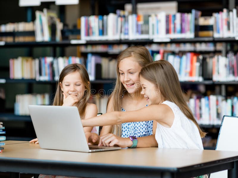 Technology in the library stock photo. Image of cute - 54920632