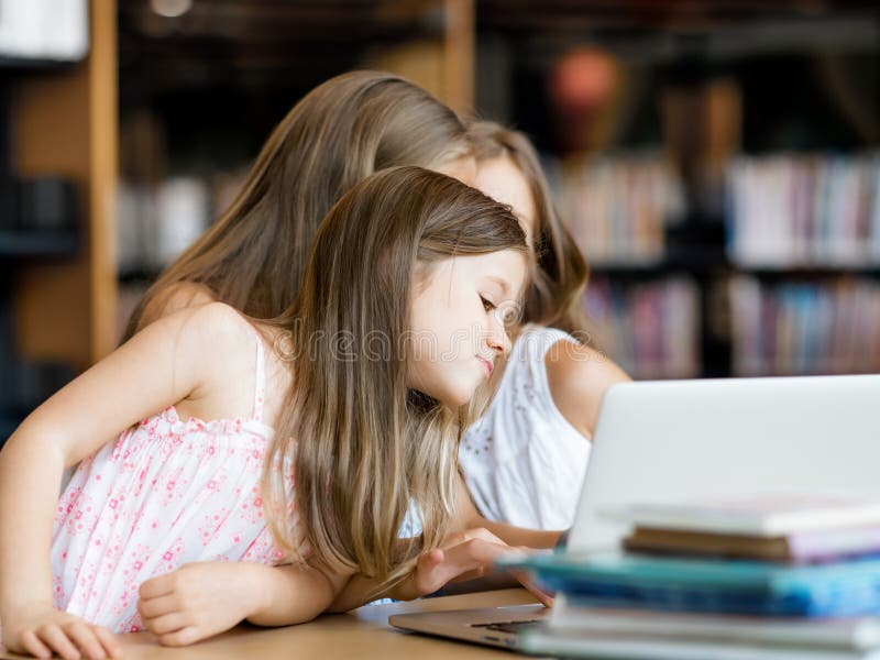 Technology in the library stock image. Image of laptop - 56384621