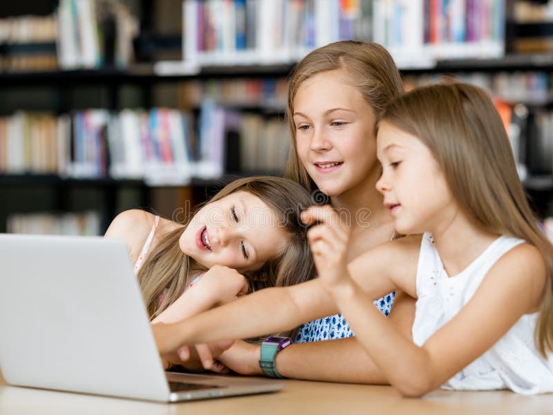 Technology in the library stock photo. Image of girl - 93106100