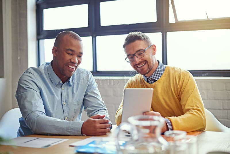 Technology Makes Working Together Easy. Two Designers Working on a ...