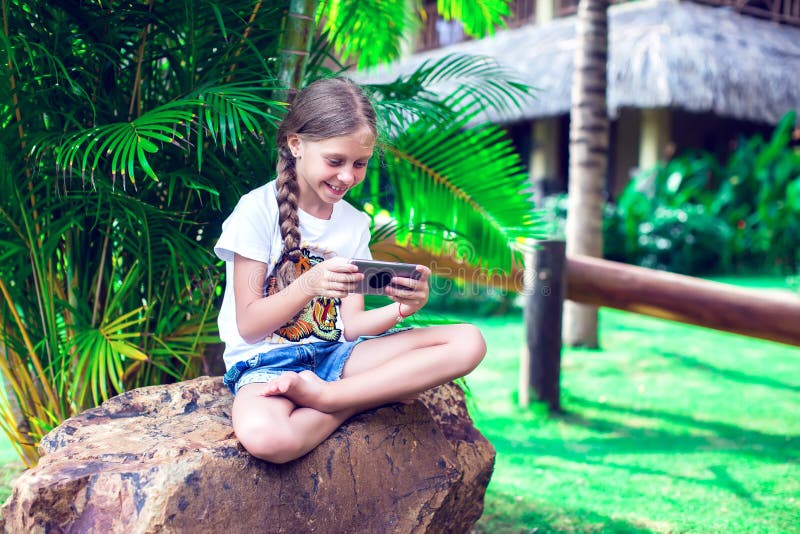 Technology and People Concept - Happy Smiling Girl Using Smartphone ...