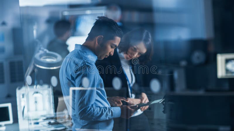 In Technology Research Facility: Female Project Manager Talks with ...