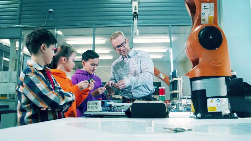Technology, School Education Concept. a Group of Kids are Studying ...