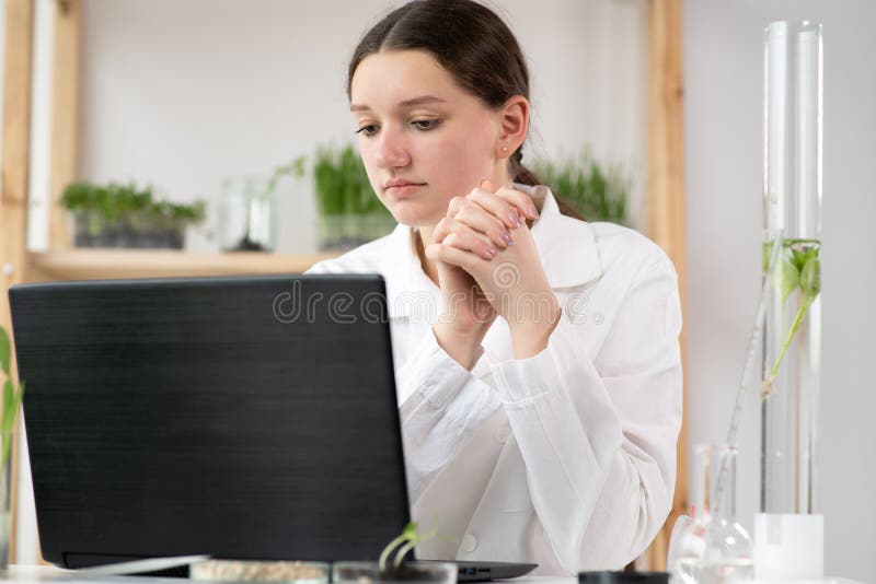 Technology in Science, Woman Scientist Uses Laptop while Working in ...