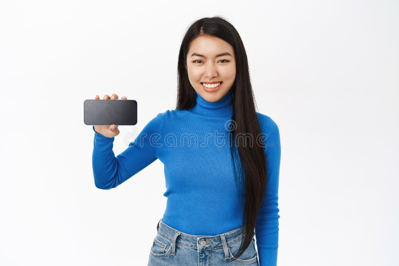 Technology. Smiling Asian Woman Demonstrates Smartphone App Screen ...