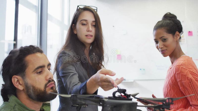 Technology Team Examining Drone on Table, Interacting with Animated ...