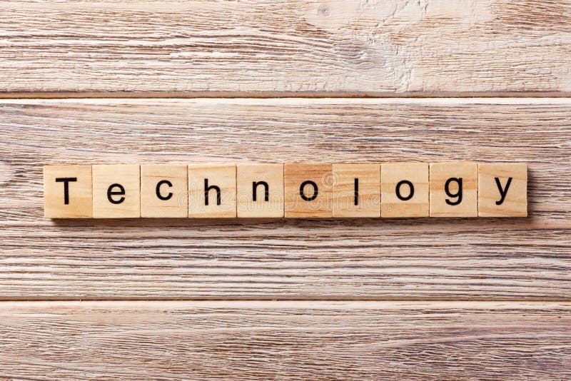 Technology Word Written on Wood Block. Technology Text on Table ...