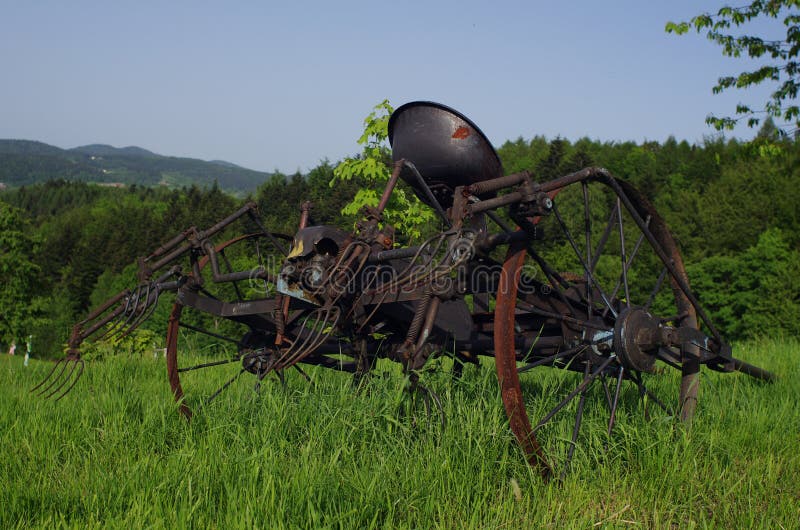 Vintage Hay Tedder on a Golden Meadow in Colorado Stock Image - Image ...