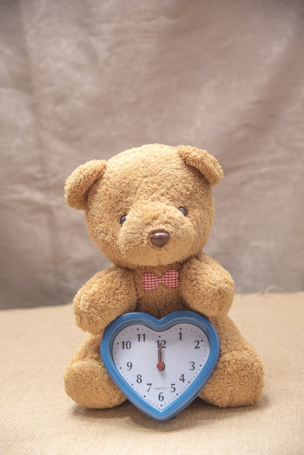 Teddy bear with clock stock photo. Image of young, lovely - 96867936
