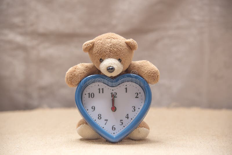 Teddy bear with clock stock photo. Image of collection - 96868452
