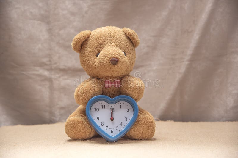 Teddy bear with clock stock image. Image of holding, teddy - 96868817