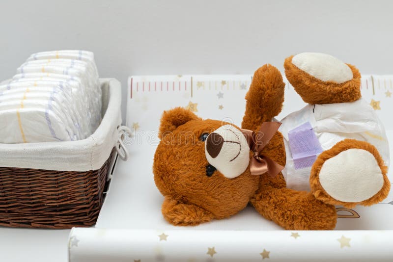 Teddy bear and diapers stock image. Image of bear, heap - 210380143