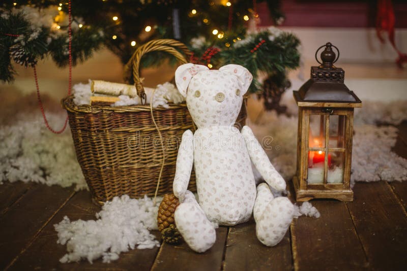 Teddy Bear Sitting Under Decorated with Lights Christmas Tree with Gift ...